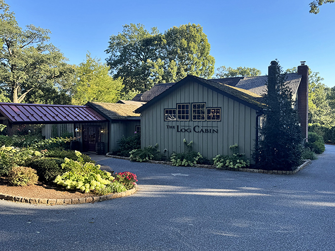 Morning sunlight bathes the weathered exterior in golden warmth, highlighting landscaping that's as meticulously maintained as the restaurant's stellar reputation.