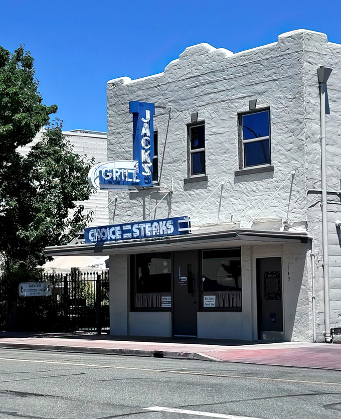 That vintage neon glow says everything about Jack's Grill &ndash; authentically timeless steakhouse magic awaits inside.