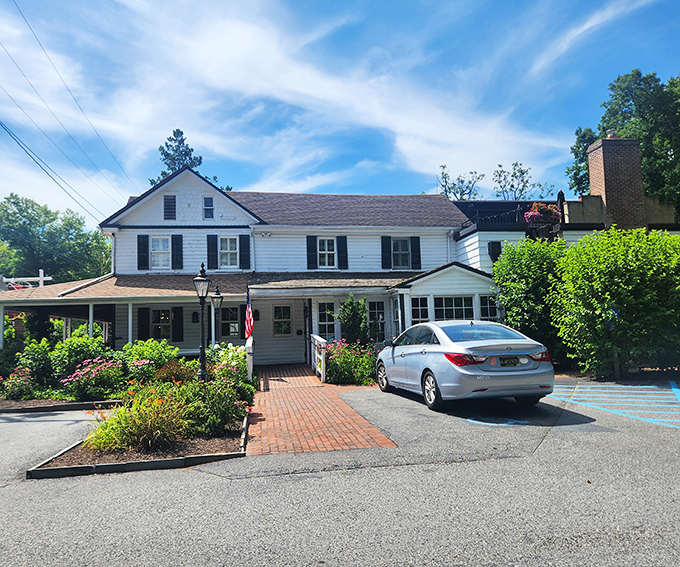 The classic white clapboard exterior of Buckley's Tavern welcomes visitors like an old friend waiting with open arms.