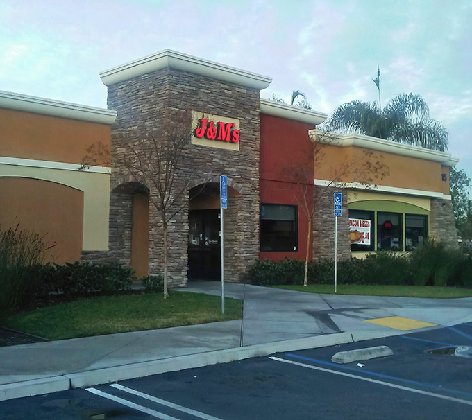 J & M&rsquo;s stone facade stands like a beacon for hungry travelers, guiding them toward hearty comfort food just inside.