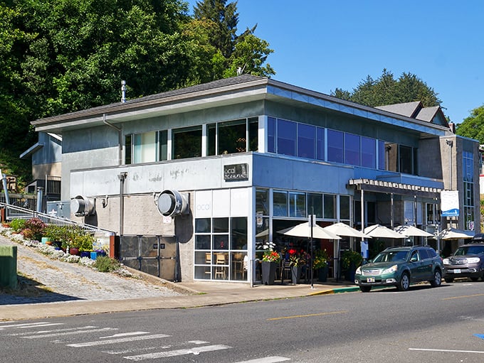 The modern exterior of Local Ocean Seafoods stands like a lighthouse for hungry travelers, beckoning with promises of oceanic delights just steps from Newport's working harbor.