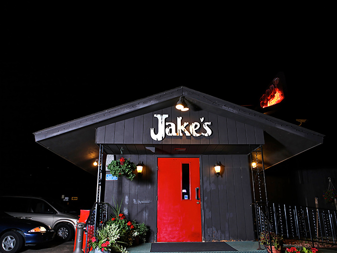 That iconic red door against the dark exterior isn't just an entrance&mdash;it's a portal to prime rib paradise that's been beckoning hungry Wisconsinites for generations.