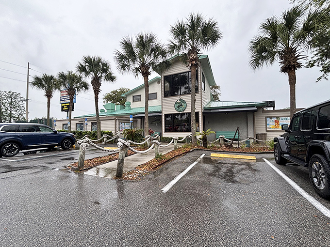 Classic Florida charm greets you at Whitey's Fish Camp, where palm trees stand guard over seafood treasures waiting inside.