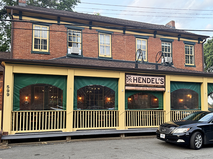 Brick, yellow trim, and those inviting green awnings &ndash; Hendel's exterior is like a warm hug in architectural form, beckoning hungry travelers to step inside.