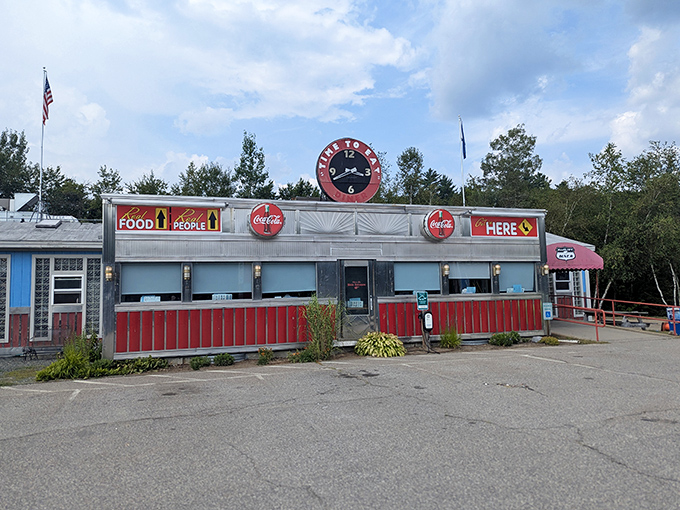 The gleaming silver exterior of 104 Diner beckons like a time machine disguised as a roadside oasis. Classic Americana at its finest.