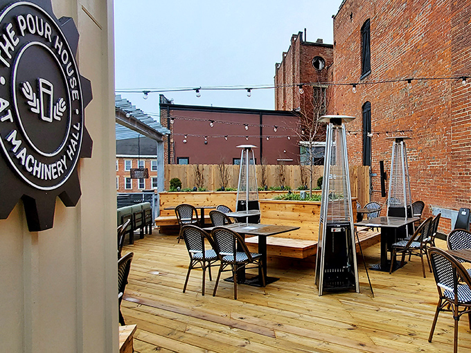 The historic brick facade of The Pour House at Machinery Hall proudly displays its mantra: "eat BETTER, drink LOCAL, live SOCIAL." Industrial heritage meets modern gastronomy.