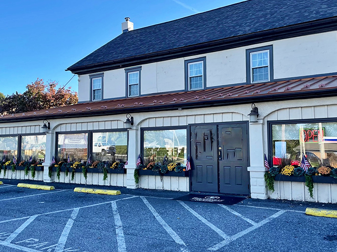 The historic white façade of Brickerville House Restaurant welcomes you with flower boxes that change with the seasons—Pennsylvania charm in architectural form.
