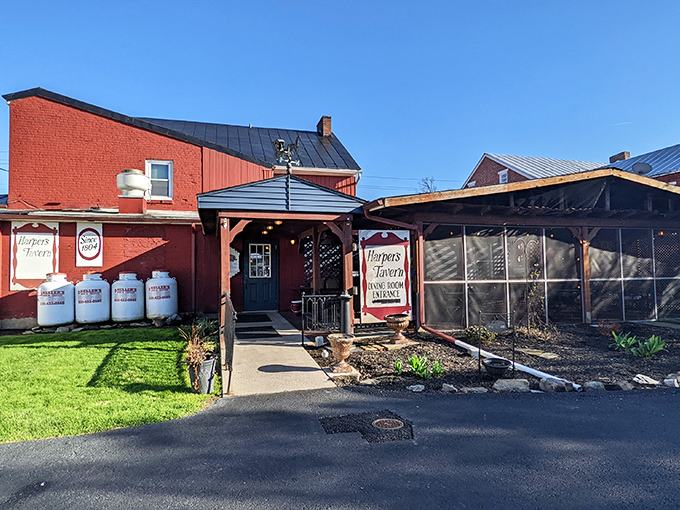 The classic brick exterior of Harper's Tavern welcomes you like an old friend, complete with white columns and that iconic vintage sign promising good times ahead.