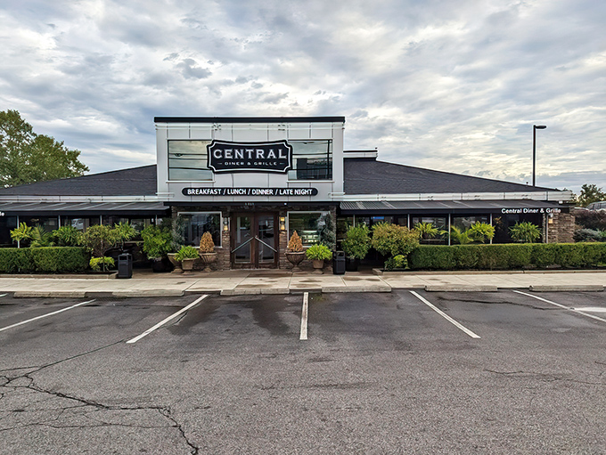 With its sleek glass front framed by lush greenery, Central Diner & Grille stands ready to serve comfort classics from sunrise to midnight.