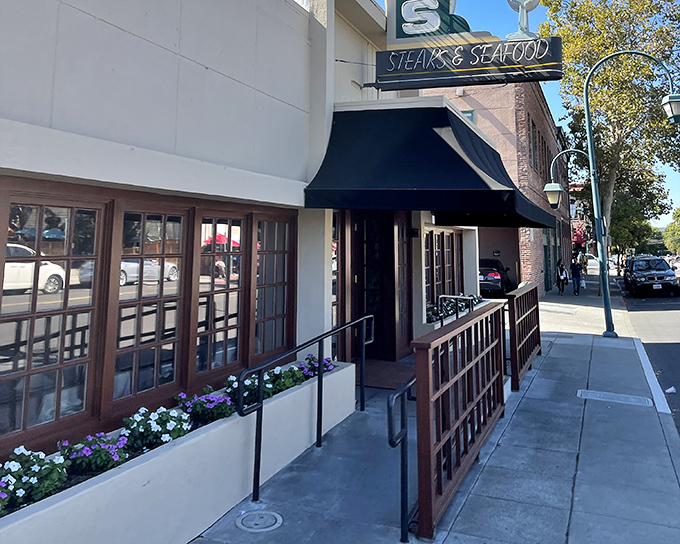 The unassuming exterior of Hap's in downtown Pleasanton hides a carnivore's paradise within. Classic steakhouse elegance awaits behind that black awning.