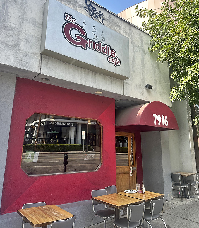 The bright red facade of The Griddle Cafe stands out on Sunset Boulevard like a beacon for breakfast enthusiasts. No green juice in sight, just pancake paradise ahead.
