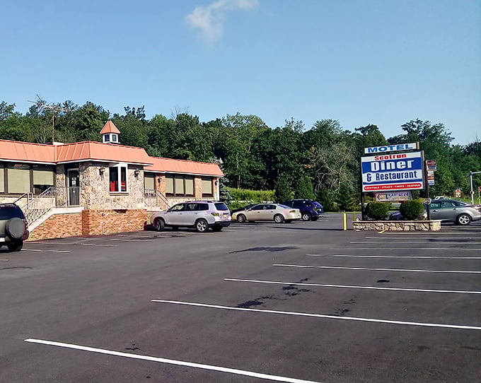 The classic roadside sign promises exactly what your soul needs right now: comfort food served with zero pretension and maximum flavor.