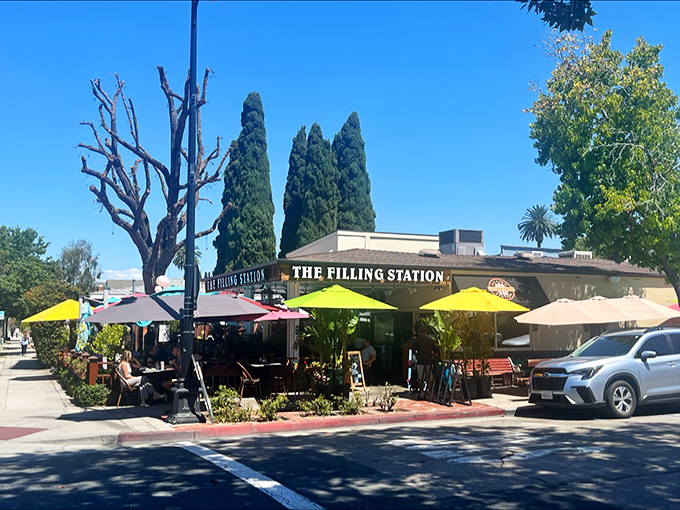 The Filling Station's sunny exterior with its vibrant yellow umbrellas isn't just inviting&mdash;it's practically waving you in for breakfast bliss.