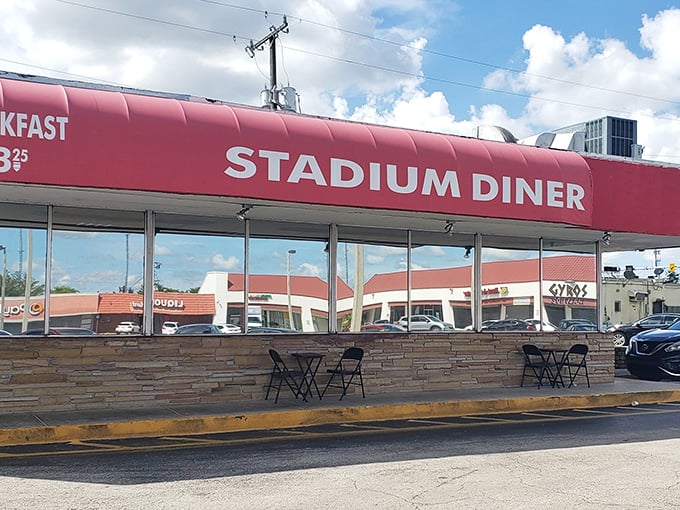 The iconic red awning of Stadium Diner stands out like a beacon for hungry Miamians, promising comfort food that transcends trendy culinary fads.