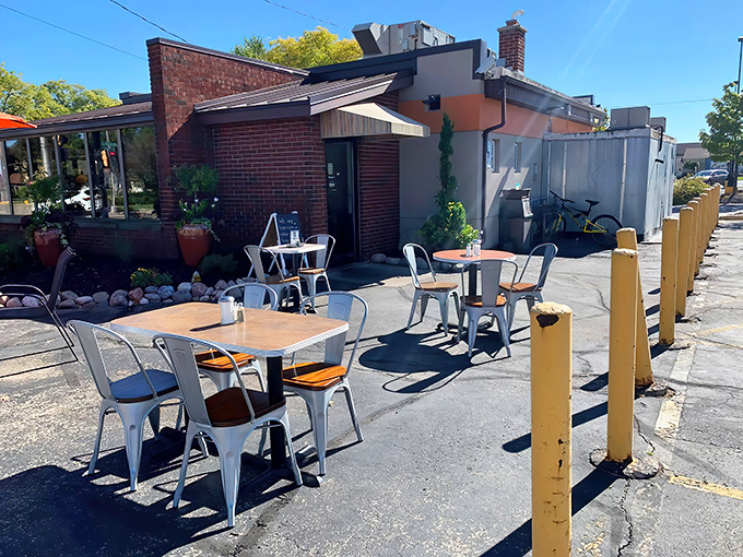 The unassuming exterior hides culinary treasures within, like finding a Picasso at a garage sale. Those yellow bollards stand guard over breakfast paradise.