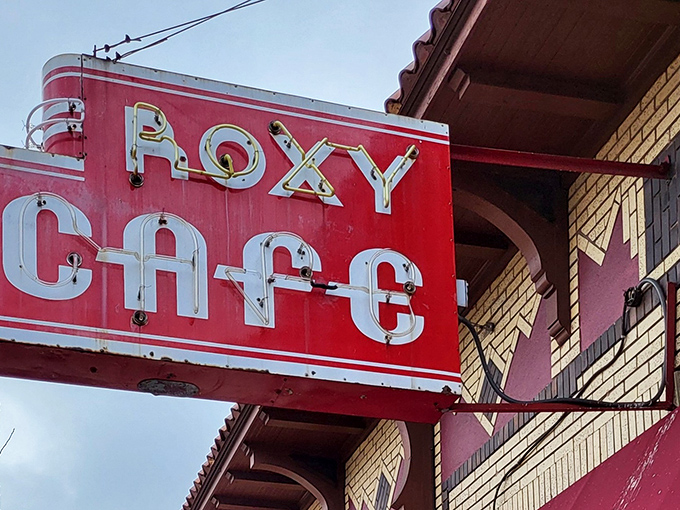 The iconic red awning of Roxy Cafe stands as a beacon of breakfast hope in downtown Jackson, where morning hunger goes to surrender.