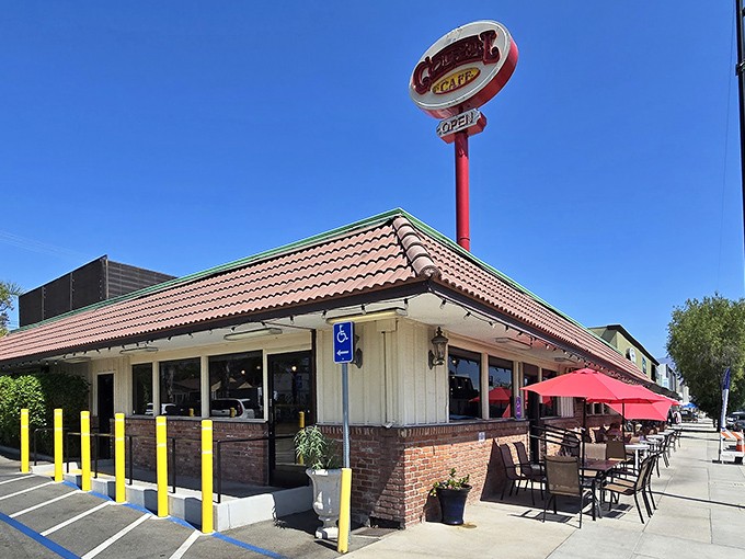 The iconic red sign beckons like a lighthouse for hungry souls. Coral Cafe's unassuming exterior hides a treasure trove of comfort food within.