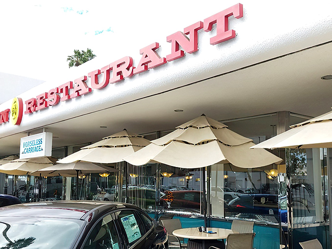 The classic red lettering and cheerful patio umbrellas promise what every great diner should: comfort food served with a side of nostalgia.