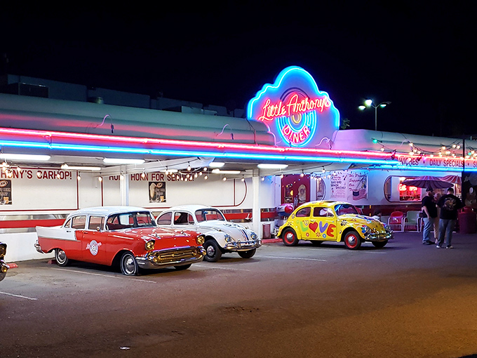 The neon glow of Little Anthony's at night is like a beacon for hungry time travelers. Classic cars complete the perfect 1950s postcard scene.