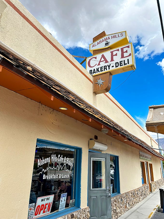 That classic vintage sign beckons hungry travelers like a desert mirage, except this oasis delivers actual sustenance instead of disappointment.