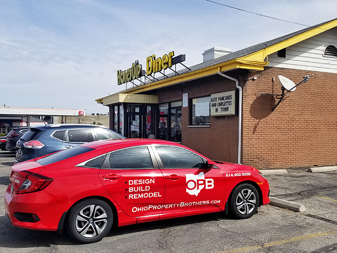 The cheerful yellow sign of Honey Dip Diner shines brightly, guiding hungry Columbus locals to hearty comfort food and classic breakfast favorites.