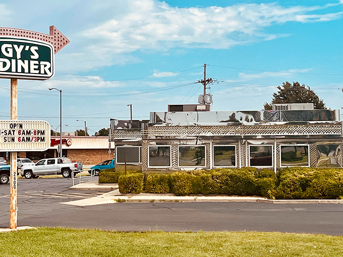 The gleaming stainless steel exterior of Iggy's Diner shines like a beacon on Route 66, promising classic American comfort with a side of nostalgia.