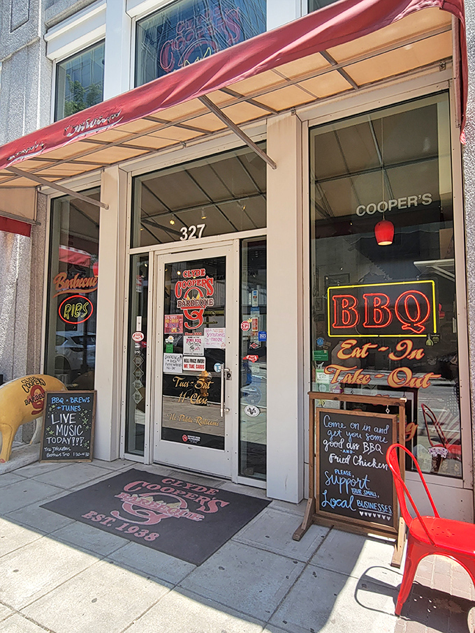 The classic diner counter setup &ndash; where strangers become friends over shared plates of Eastern-style barbecue and stories flow as freely as sweet tea.