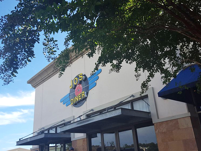 The retro-fabulous sign at Jo's Diner promises a time-traveling culinary adventure. That pink vinyl record logo isn't just decoration—it's a preview of the nostalgia served inside.
