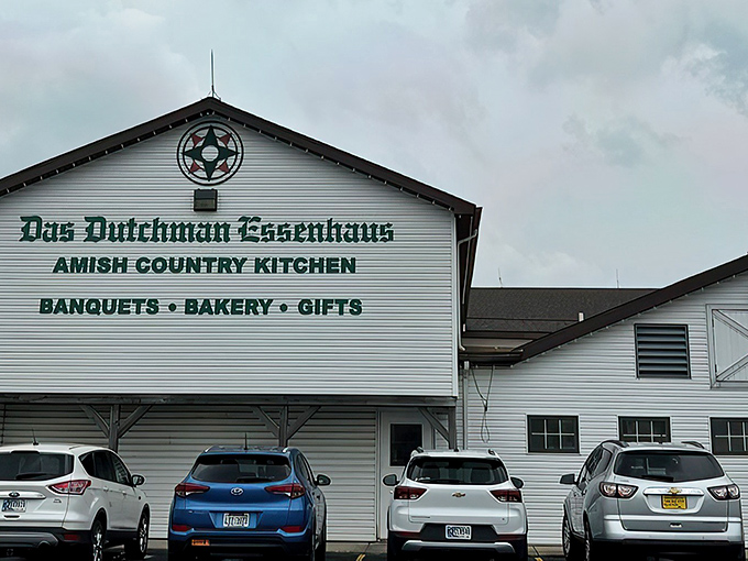 The white clapboard exterior of Das Dutchman Essenhaus stands like a time portal to simpler days, promising comfort food that'll hug your soul.