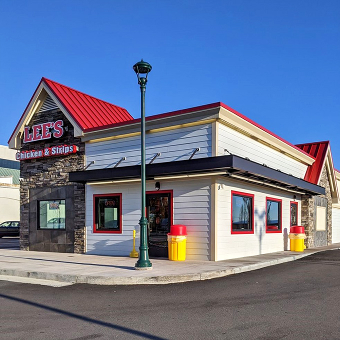 The red-roofed beacon of chicken perfection stands proudly on the corner, promising comfort food that delivers on its "Famous Recipe" claim.