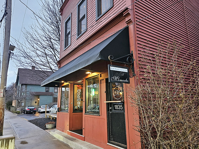 Momocho's burgundy exterior stands like a culinary beacon in Ohio City, promising modern Mexican delights behind that elegant script signage.