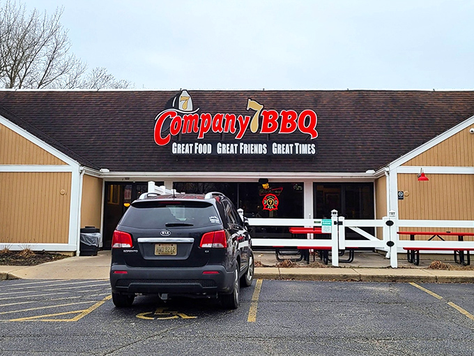 The promise of smoky delights awaits behind that red sign. Company 7 BBQ's unassuming exterior hides flavor explosions that would make your taste buds stand at attention.