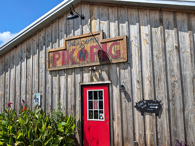 That hand-painted sign says it all&mdash;welcome to barbecue paradise. The red door practically winks at you, promising smoky treasures within.