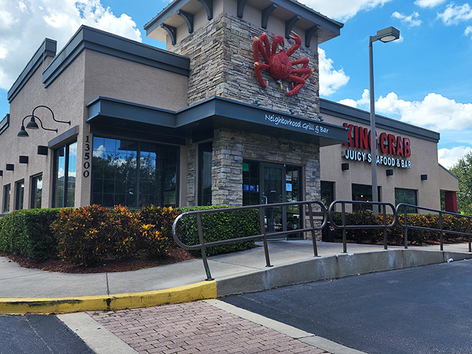 That giant red crab on the stone wall isn’t just for show—it’s a beacon drawing seafood lovers in from far and wide.