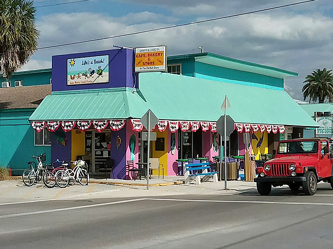 The technicolor dreamcoat of breakfast spots! Ginny's & Jane E's turquoise-and-purple exterior promises Florida whimsy before you even step inside.