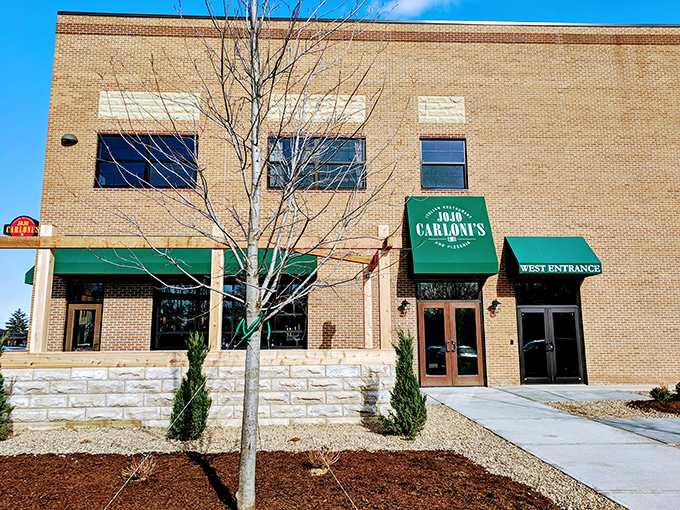 The brick exterior of Jo Jo Carloni's welcomes you with its distinctive green awnings&mdash;like an Italian grandmother beckoning you in for Sunday dinner.
