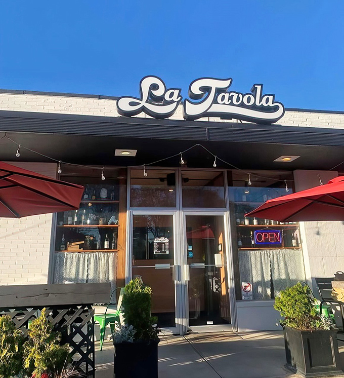 La Tavola's unassuming white exterior with cheerful red umbrellas is like that quiet friend who turns out to be the life of the party.