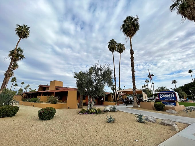 Palm Springs perfection: Elmer's exterior basks in desert sunshine while the San Jacinto Mountains stand guard like hungry sentinels waiting for breakfast.