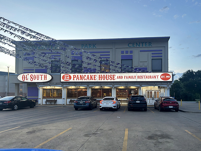 Twilight transforms this 24-hour diner into a beacon for hungry night owls and early birds alike. The sign's gentle glow promises comfort food at any hour.
