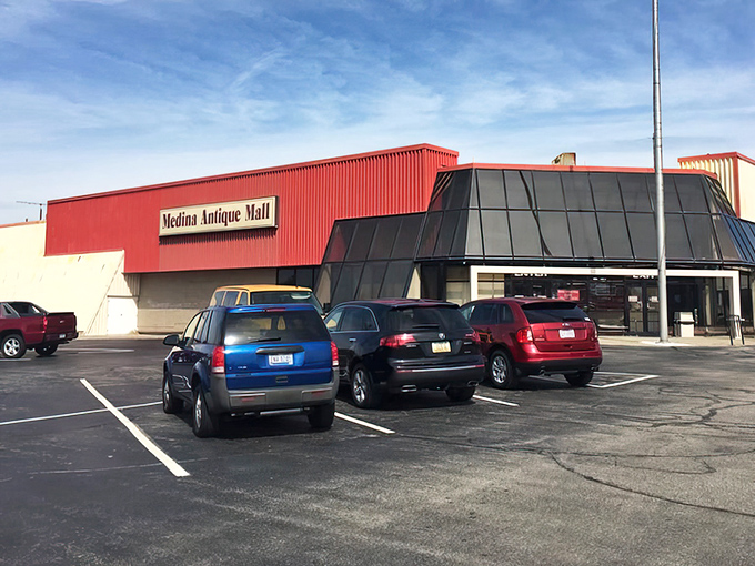 The bright red exterior of Medina Antique Mall stands like a beacon for treasure hunters. Inside awaits a labyrinth of memories and potential discoveries.