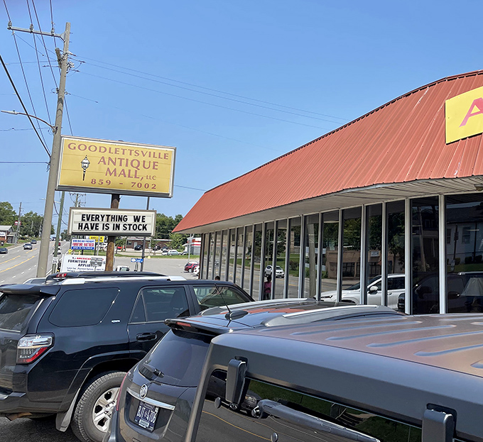 The distinctive red-roofed building beckons treasure hunters with its curved facade and promise of vintage delights waiting inside.