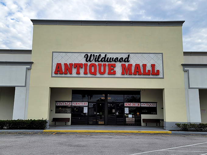 The unassuming exterior of Wildwood Antique Mall belies the wonderland of vintage treasures waiting inside, like a time-travel portal disguised as a strip mall storefront.