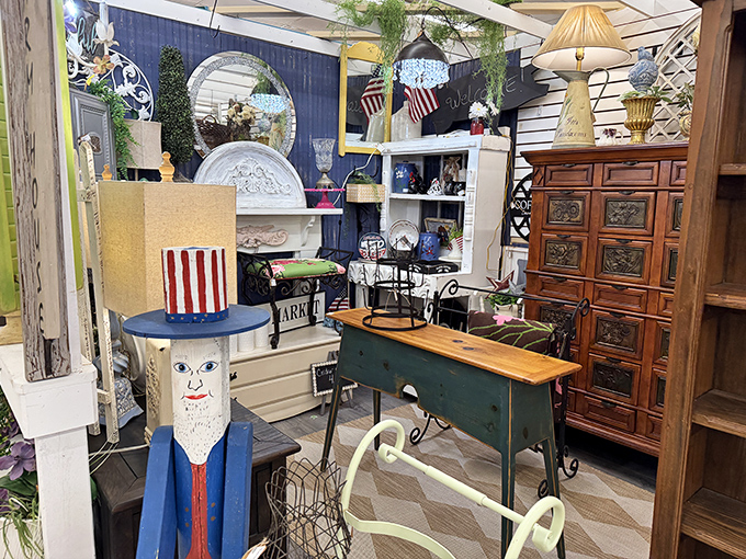 The unassuming storefront of Antiques & Uniques transforms into a wonderland after dark, beckoning treasure hunters with its warm glow against the Florida night.