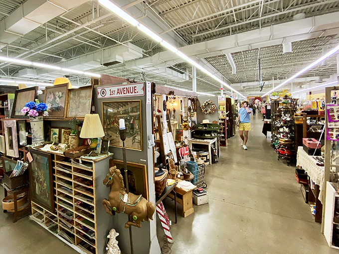 Welcome to treasure hunter heaven! Antiques Village's "1st Avenue" beckons with vintage lamps, wooden horses, and countless curiosities waiting to share their stories.