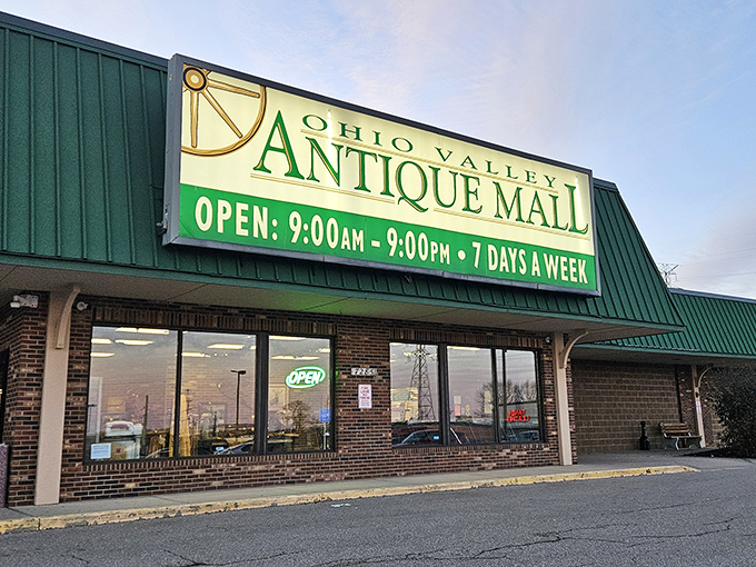 The iconic green-roofed entrance to Ohio Valley Antique Mall beckons treasure hunters with its promise of vintage wonders waiting inside. Open 12 hours daily!