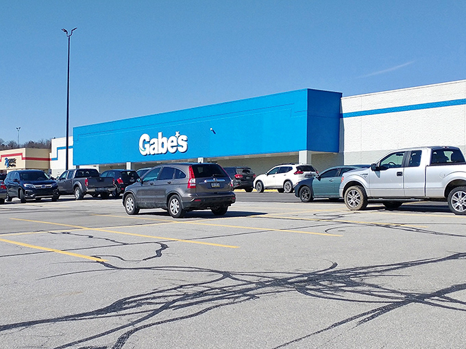 The iconic blue Gabe's sign glows like a beacon for bargain hunters, promising treasure troves of discounts within those unassuming walls.