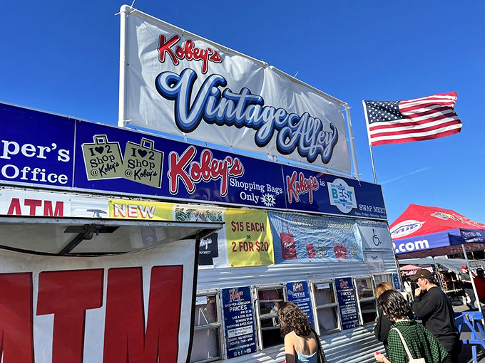 Vintage Alley: where yesterday's treasures await new homes. The American flags flutter overhead as if to say, "Shopping is patriotic!"