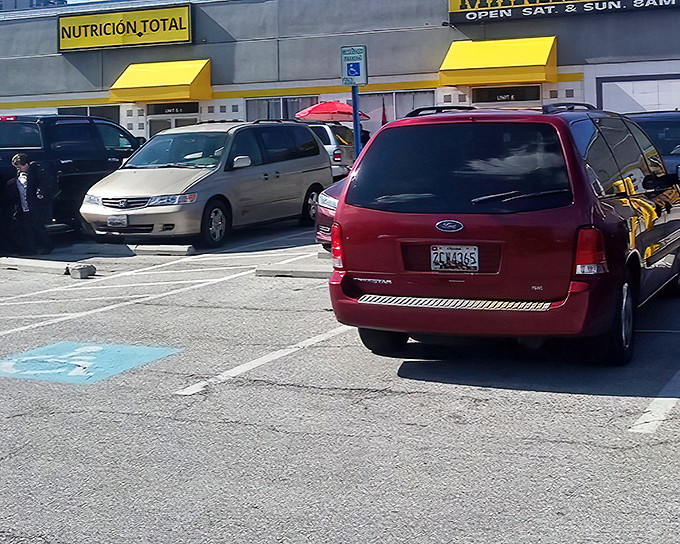 The bright yellow awnings of Washington Boulevard Marketplace beckon like a beacon of bargain possibilities, promising treasures waiting to be discovered inside.