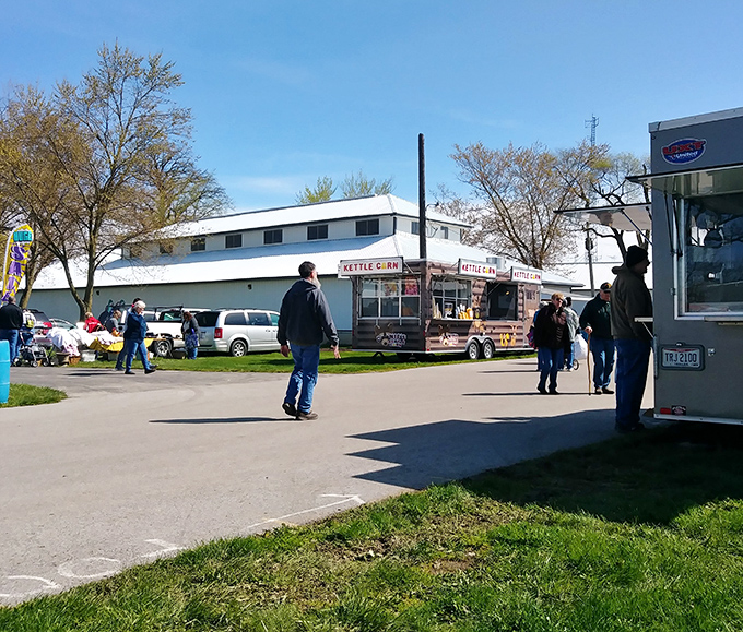 The fairgrounds transform into a treasure hunter's paradise on market days. Food trucks and white buildings create the perfect backdrop for discovery.