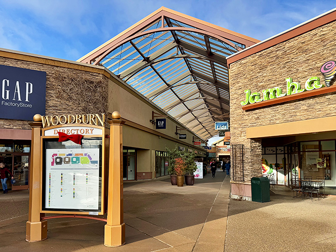 The towering welcome sign stands like a retail lighthouse, guiding bargain hunters to their shopping paradise. No sales tax makes those designer discounts even sweeter!